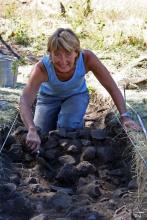 Archaeologist Sandra Peacock excavates an ancient earth oven. | Society ...